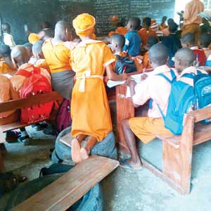 Lagos secondary school where students sit on floor, windows to receive ...