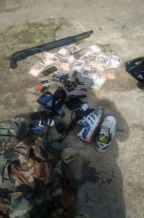 In photos: Man arrested with soldier uniforms in Rivers state ...